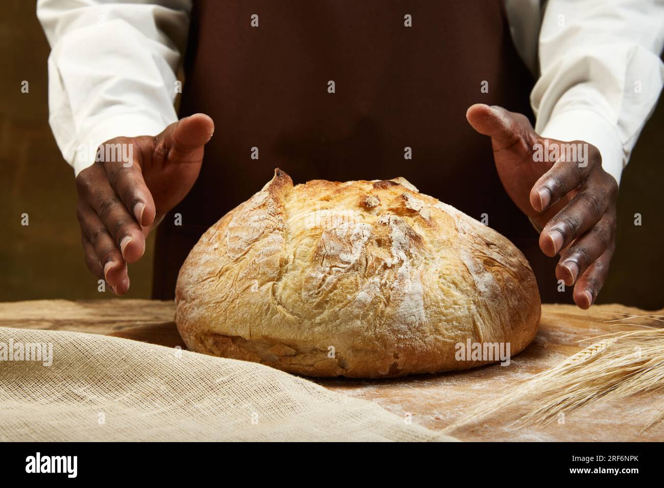 Traditional wedding round loaf of bread, and baker's hands Stock Photo ...