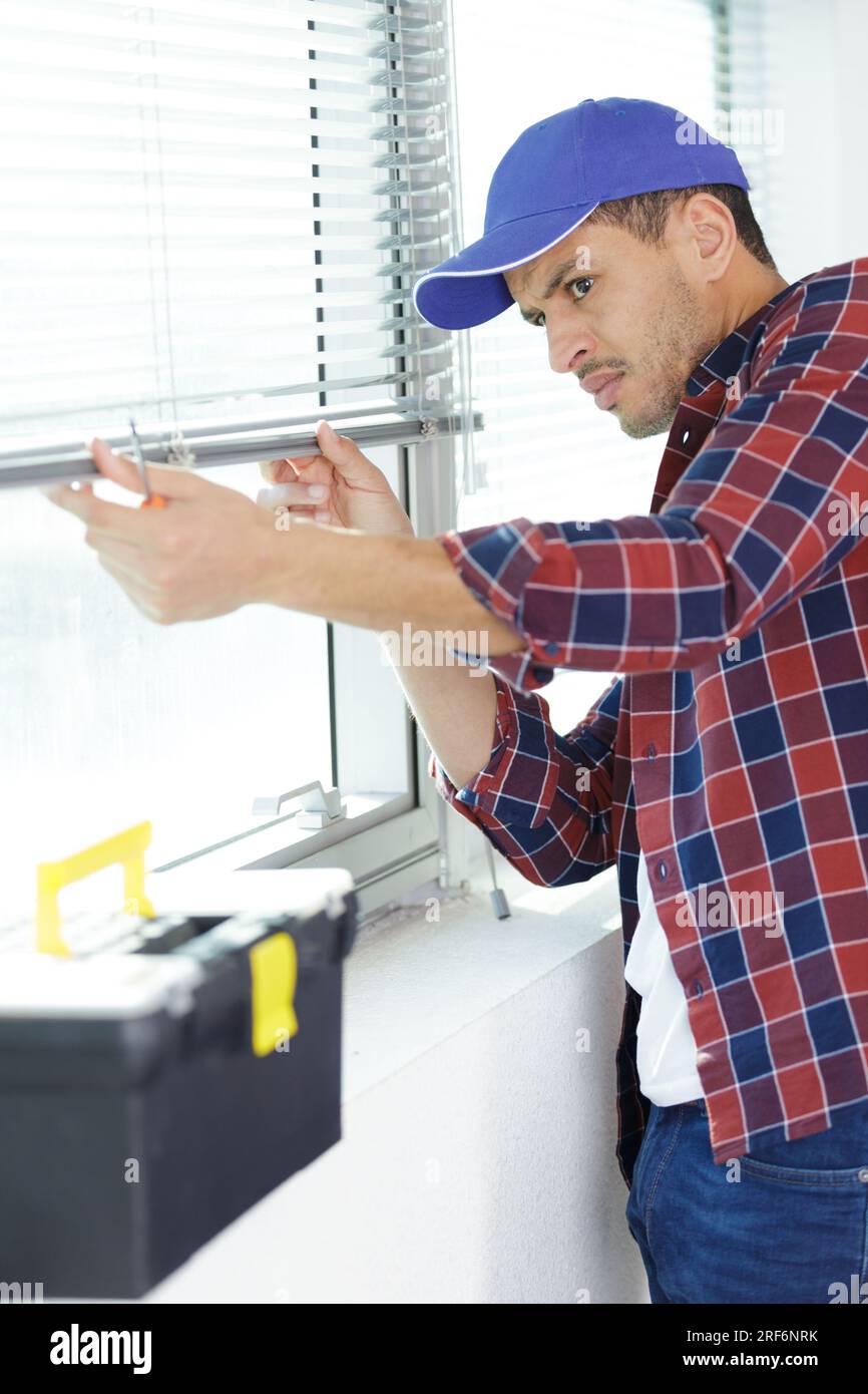 Installing window blinds hi-res stock photography and images - Alamy