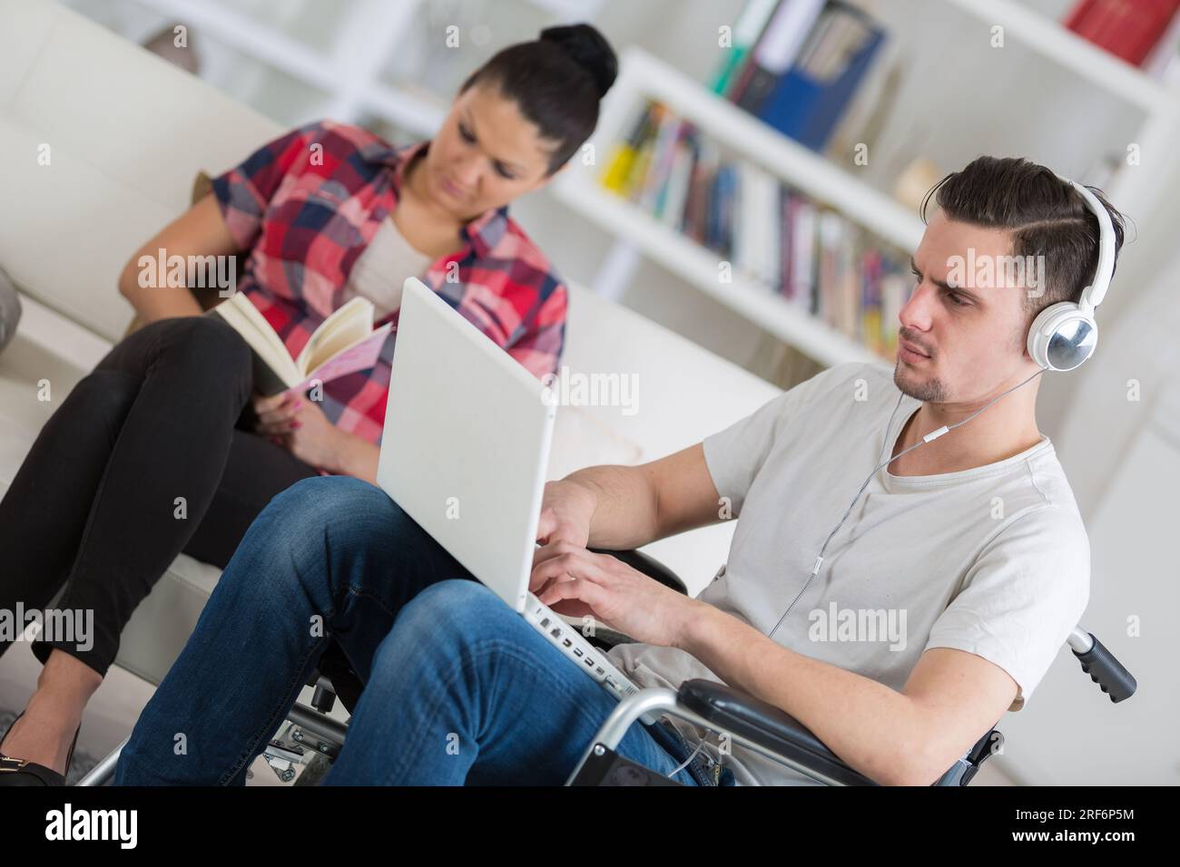 Paralyzed manager man using computer hi-res stock photography and ...