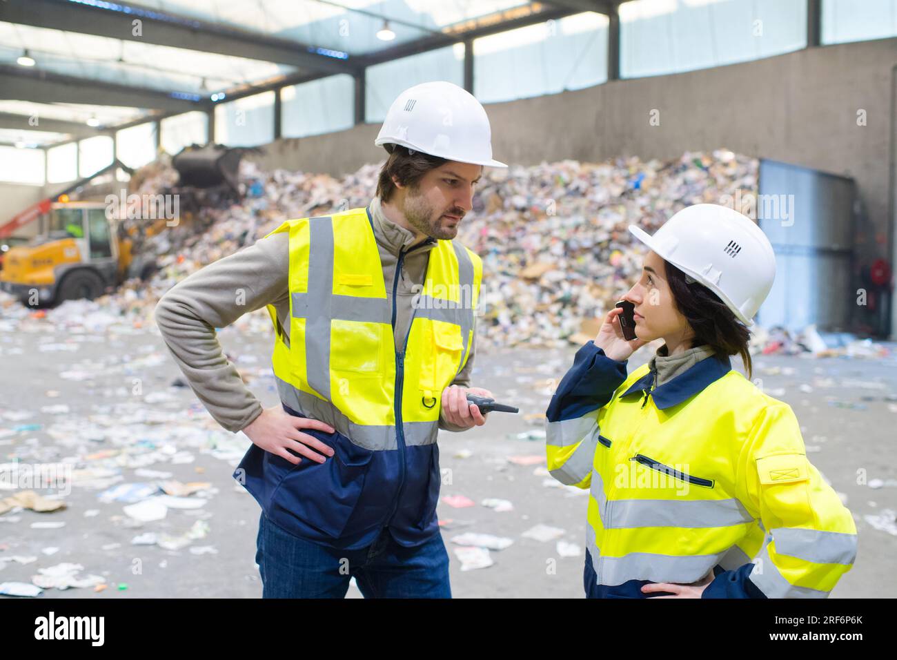 recycling plant worker wearing hardhats Stock Photo - Alamy