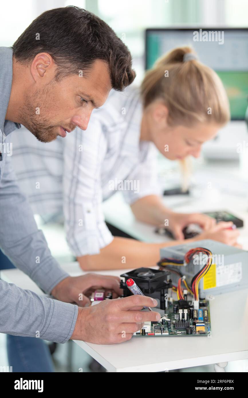 Male tech repairs electronic equipment hi-res stock photography and ...