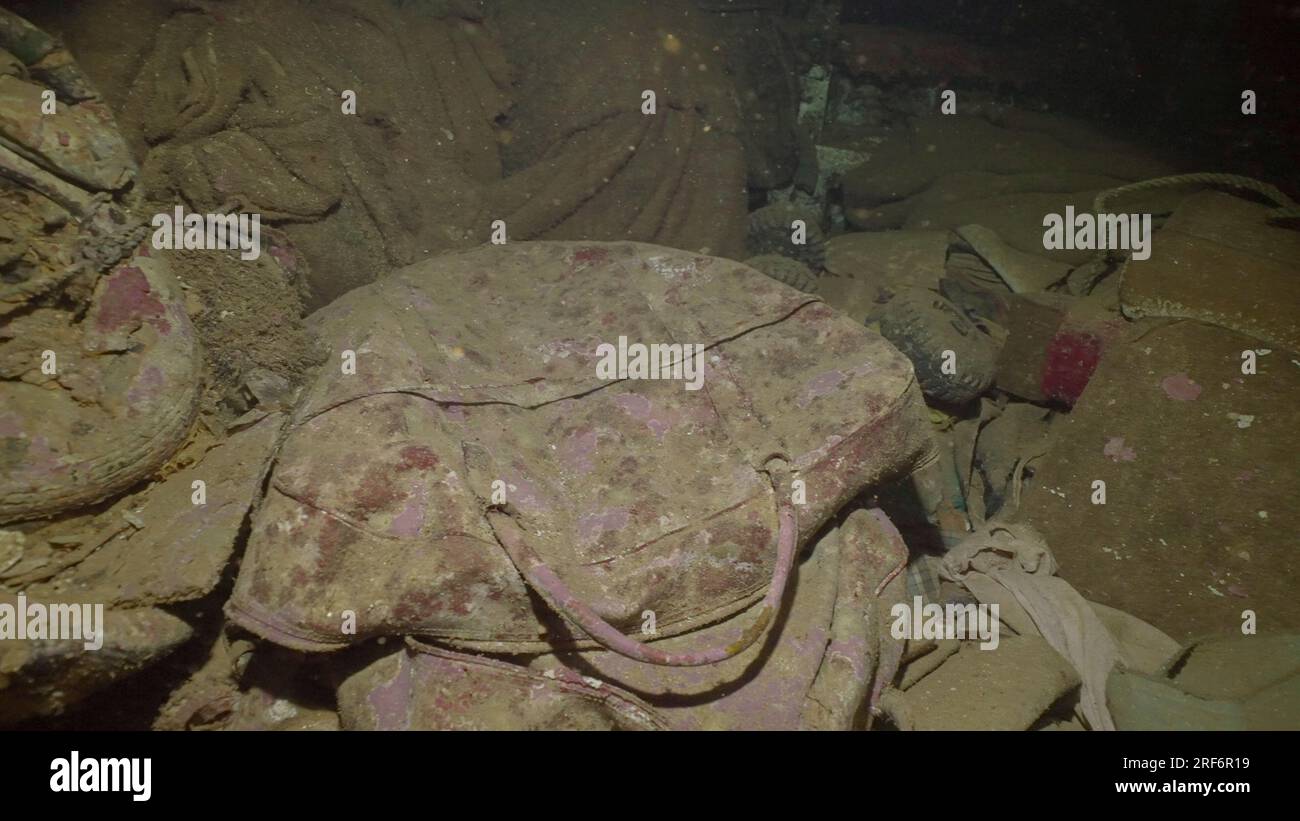 Passengers luggage and personal belongings lie inside hold of ferry ...