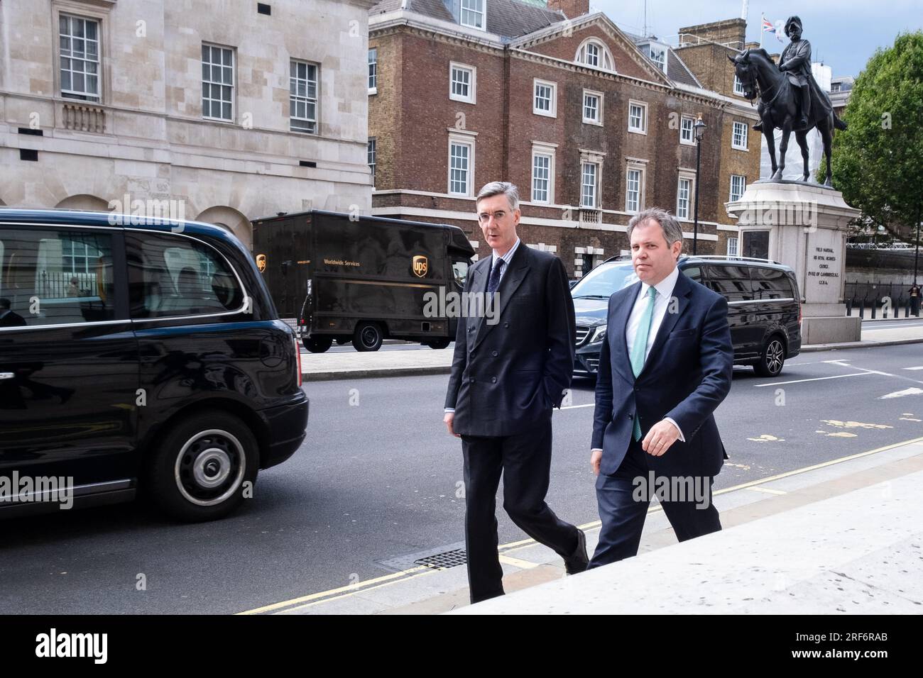 Conservative MPs Jacob Rees-Mogg (left) and Edward Argar walking past ...
