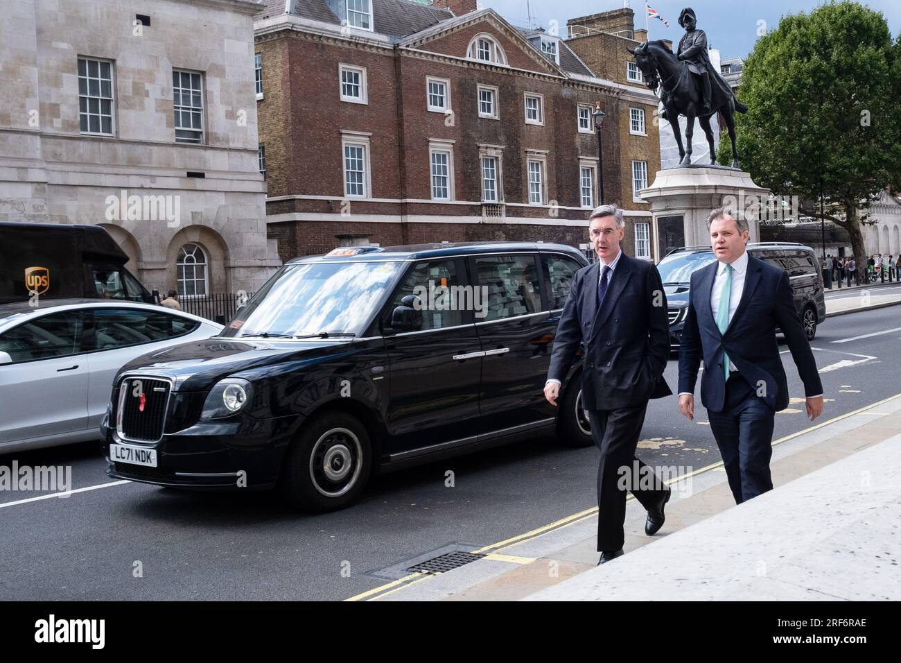 Conservative MPs Jacob Rees-Mogg (left) and Edward Argar walking past ...