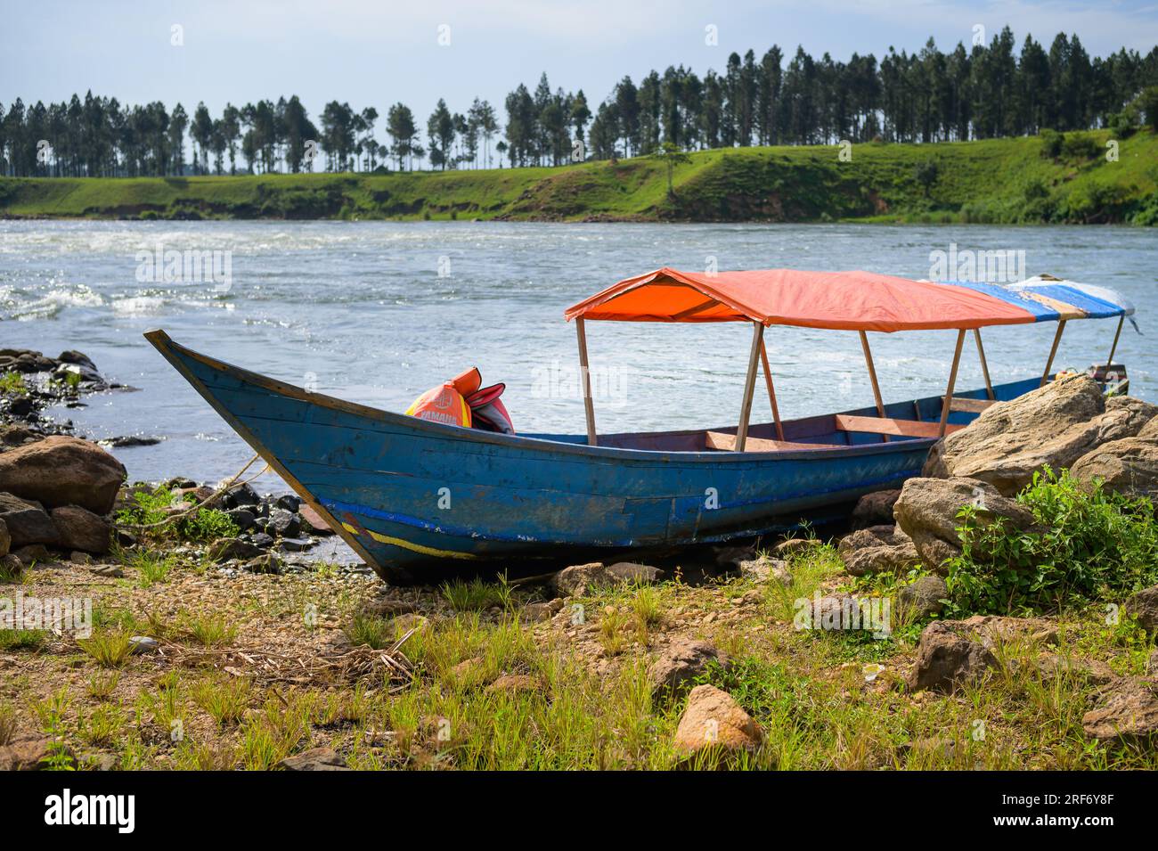 Jinja, Uganda - June 2, 2022: A small blue boat on the Nile near the ...
