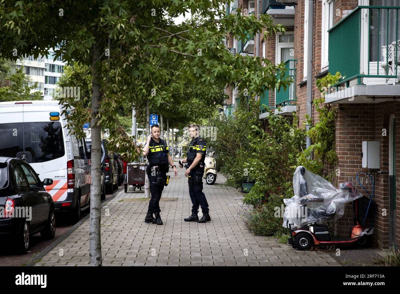 AMSTERDAM - Emergency workers at a home in Robert Scottstraat where two ...