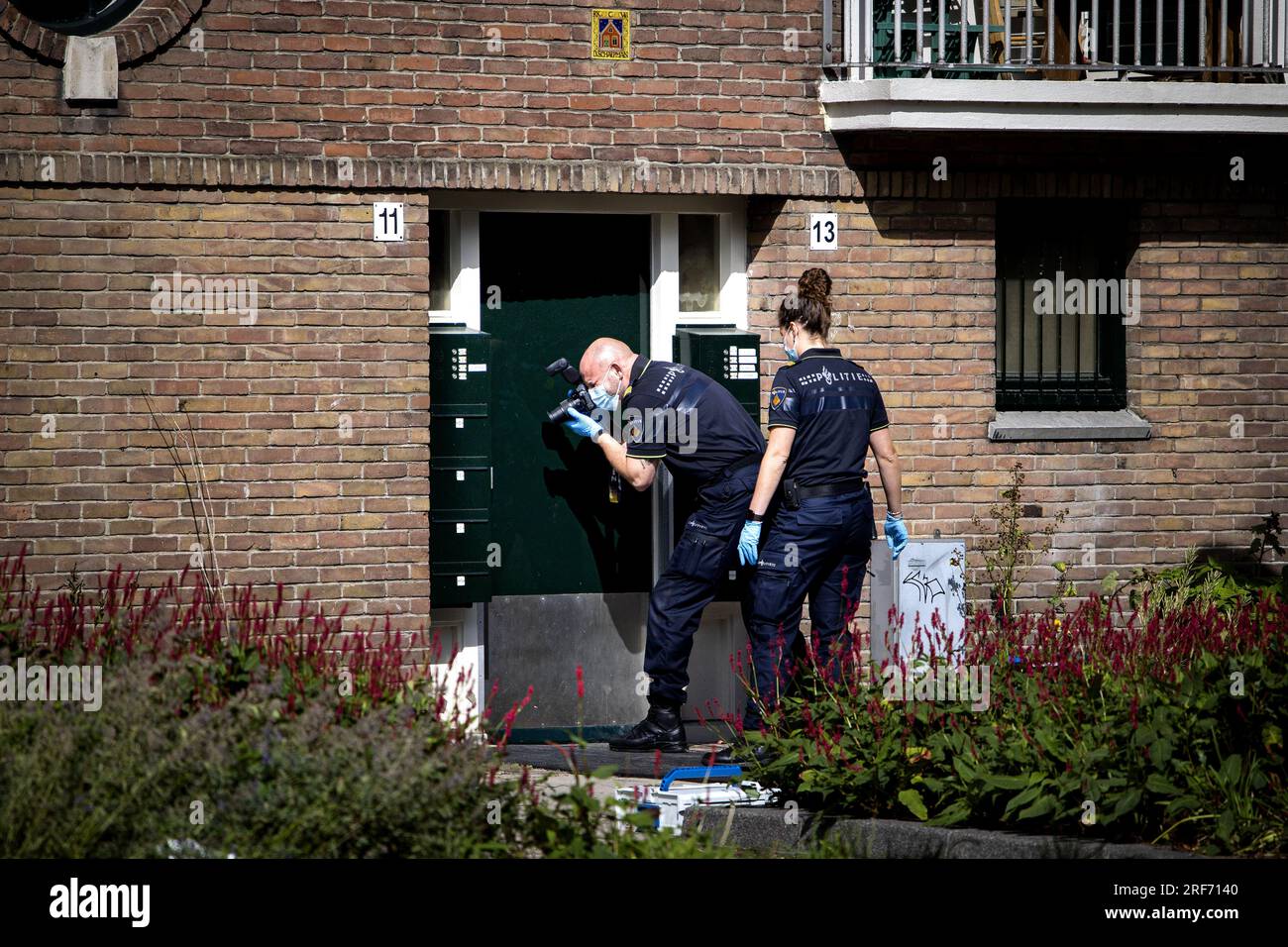 AMSTERDAM - Emergency workers at a home in Robert Scottstraat where two ...