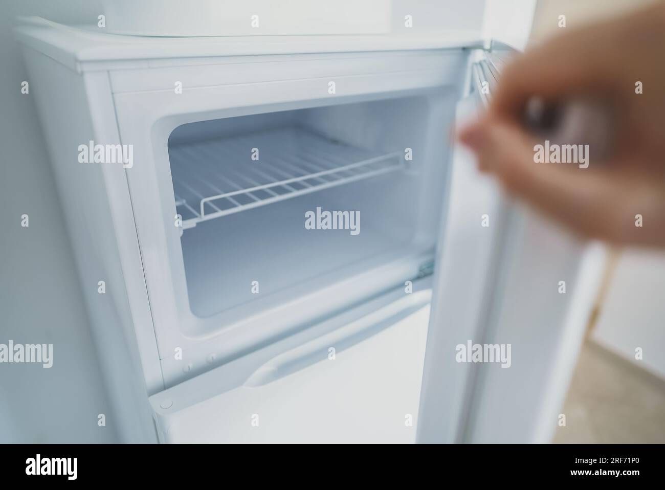 Hand cleaning refrigerator door hi-res stock photography and images - Alamy