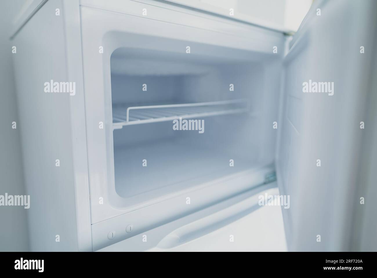 Empty open freezer in the refrigerator Stock Photo - Alamy