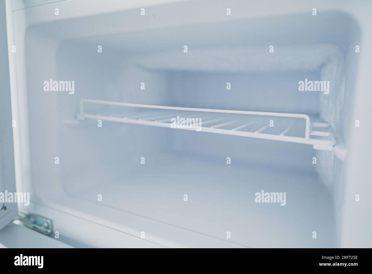 Empty open freezer in the refrigerator Stock Photo - Alamy