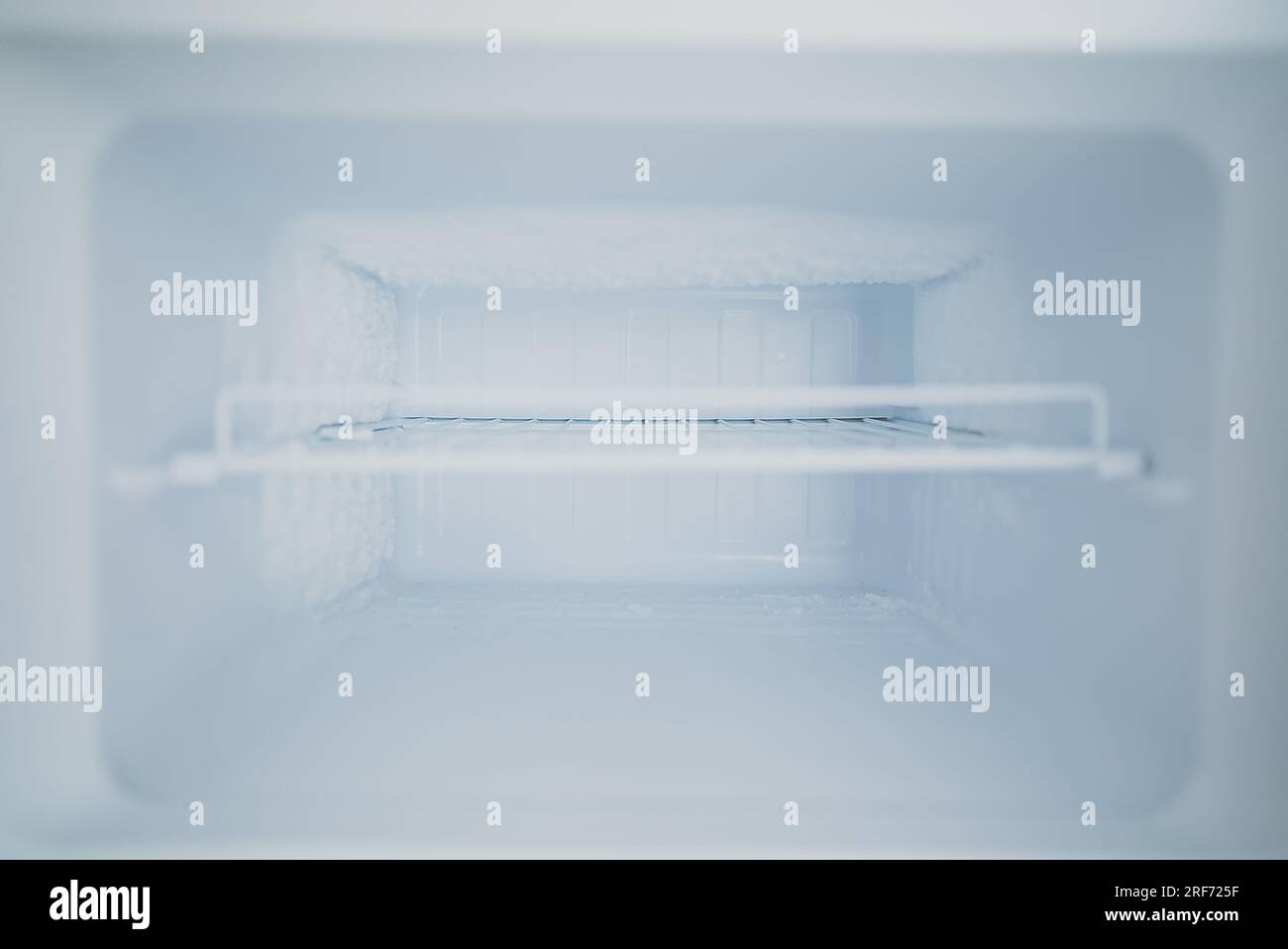 Empty open freezer in the refrigerator Stock Photo - Alamy