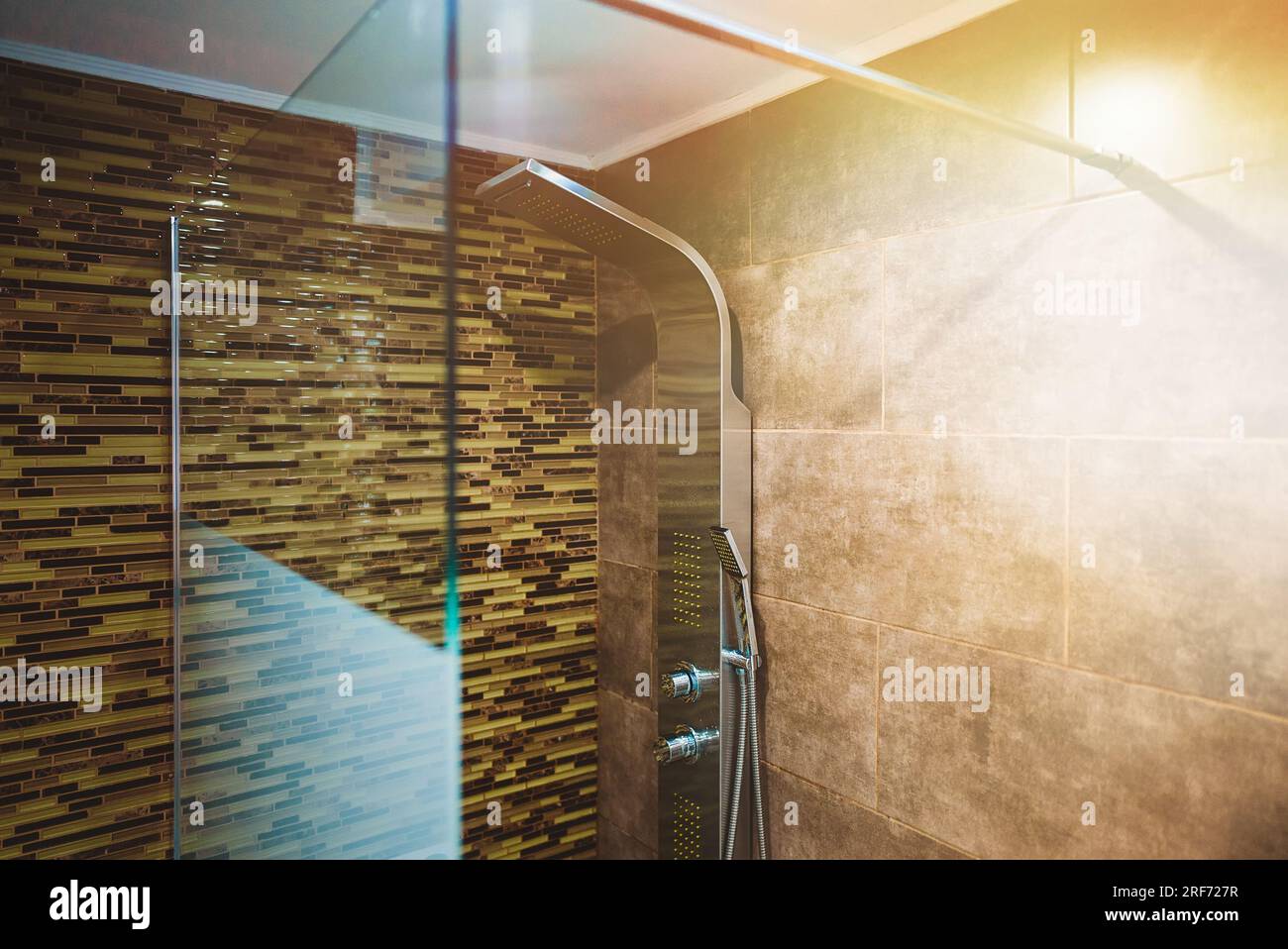 Modern shower panel in tiled bathroom Stock Photo - Alamy
