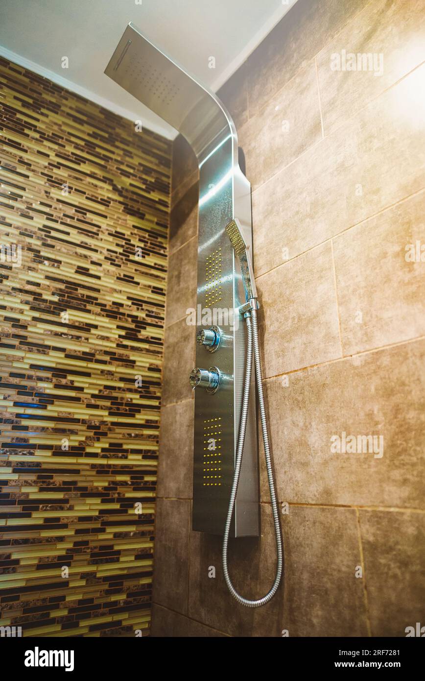 Modern shower panel in tiled bathroom Stock Photo - Alamy