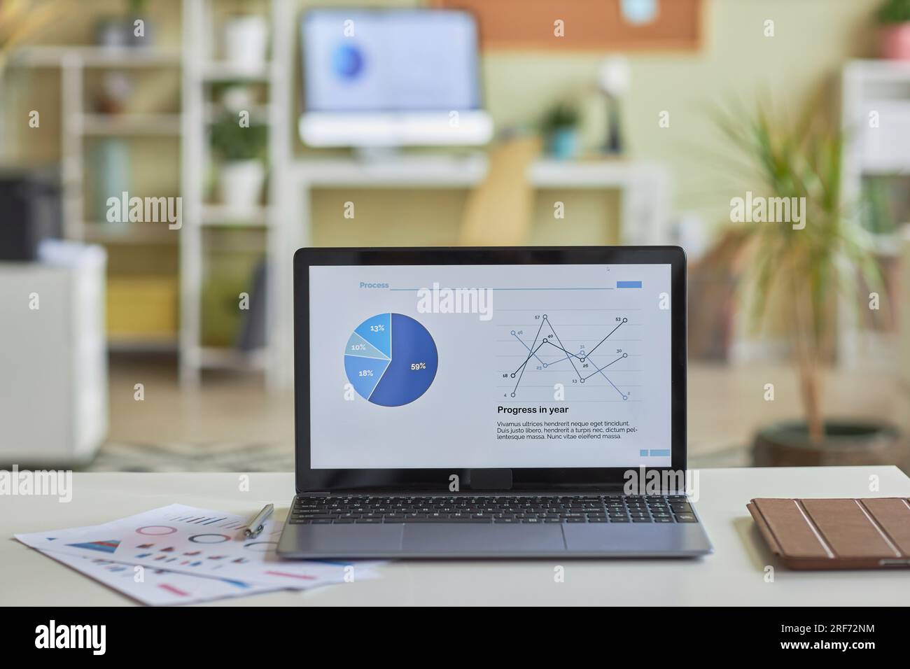 Background image of open laptop computer with statistics data charts on ...