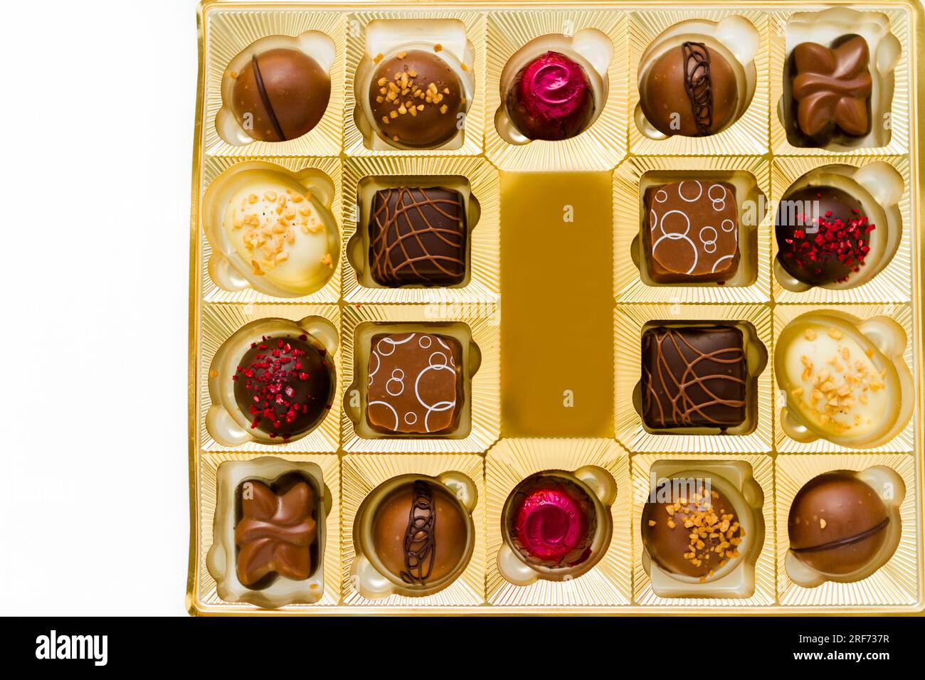 Small chocolate wrapped in gold hi-res stock photography and images - Alamy