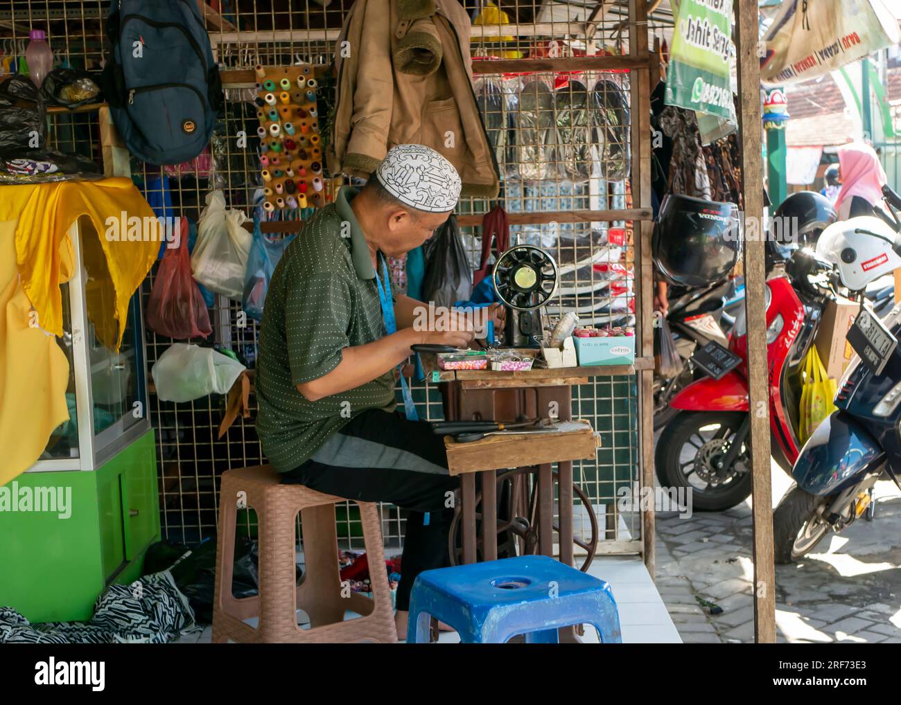 Yogyakarta-Indonesia, July 19, 2023: An old Indonesian tailor man in ...