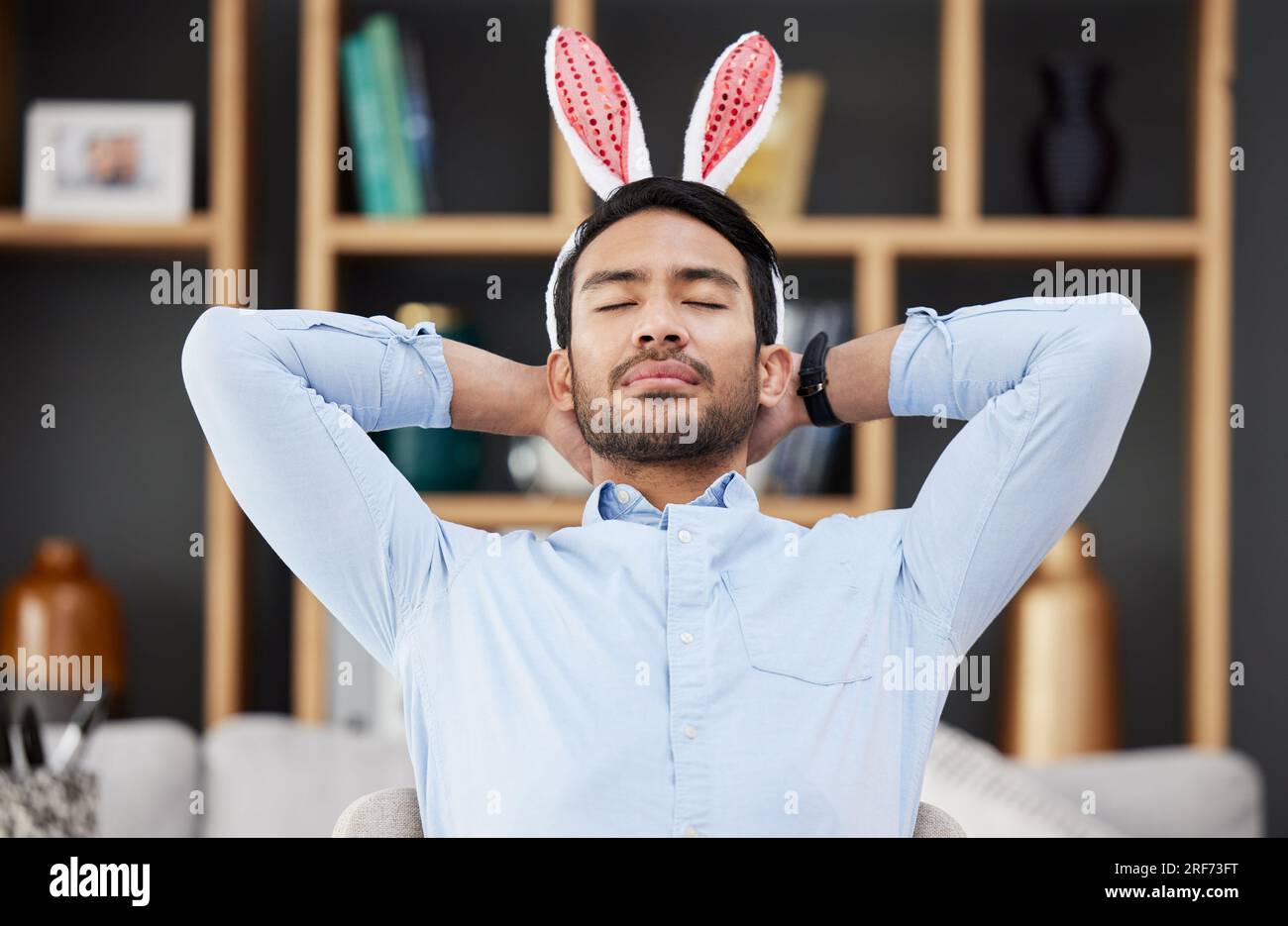 Bunny ears, easter and business man sleeping or tired in an office ...