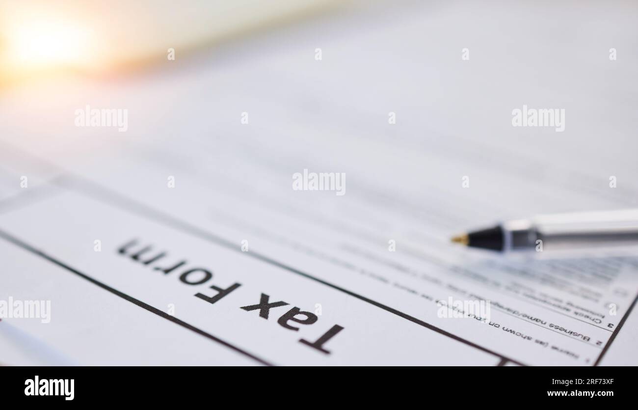 Taxes paperwork, closeup and finance with accounting, form for income ...