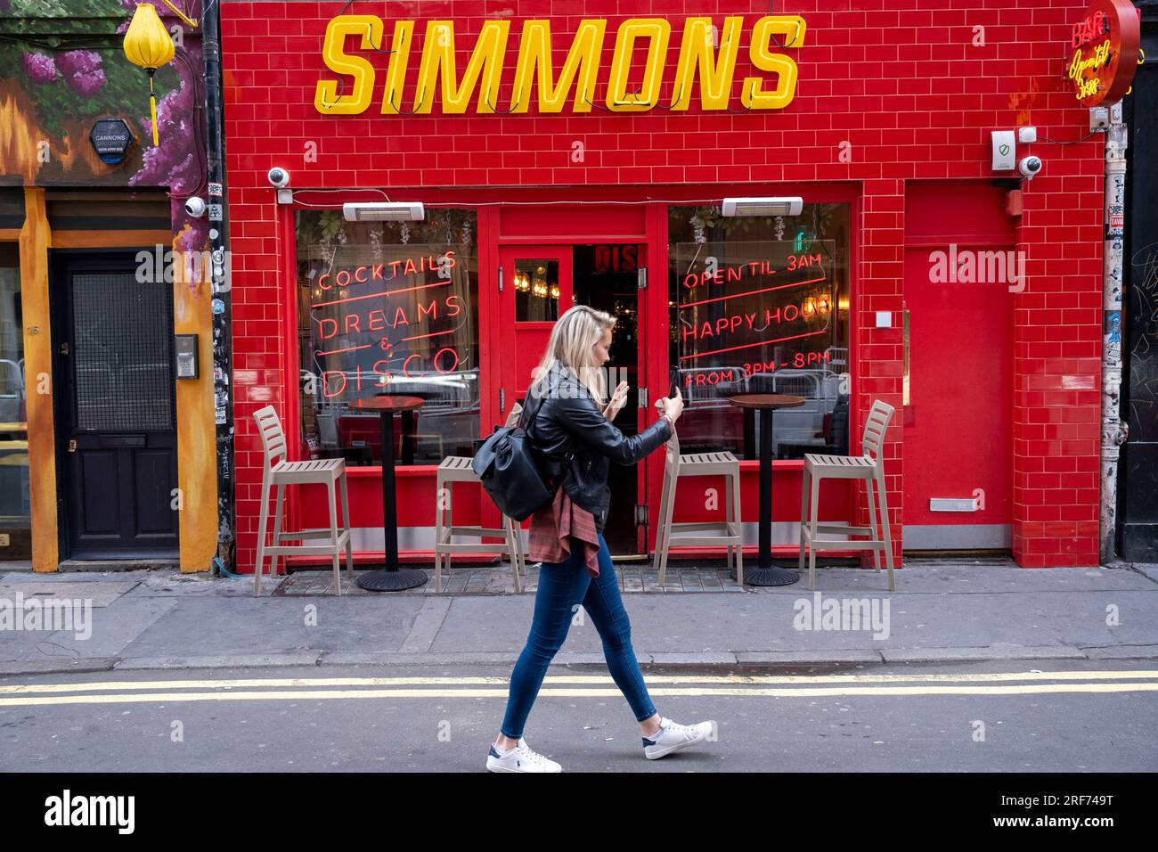 Cocktails and Dreams and Disco neon sign in the window of Simmons Bar ...