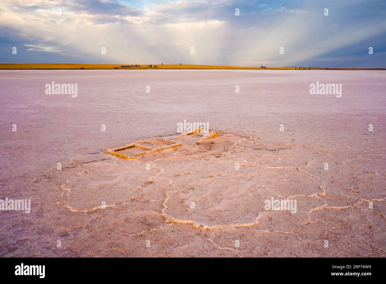Low angled view of salt encrusted scrap metal on Lake Tyrrell at ...