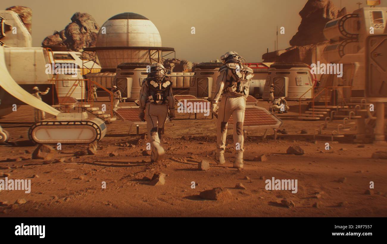 Two astronauts in spacesuits walk toward research station, colony or ...