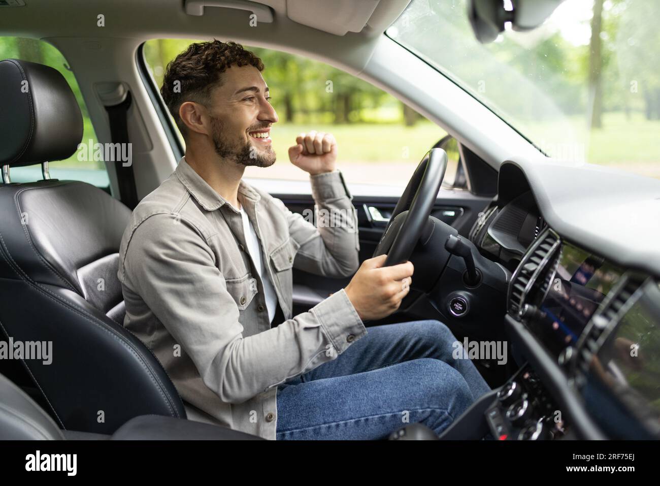 Hispanic man steering vehicle hi-res stock photography and images - Alamy