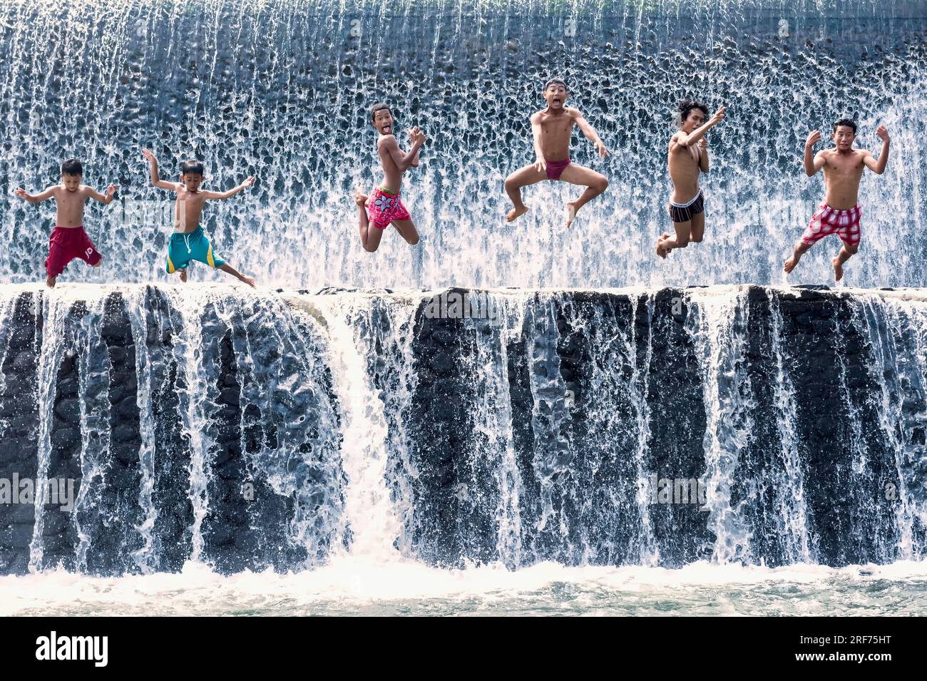 Bali, Indonesia, Boys jumping in a waterfall and having fun, Bali ...