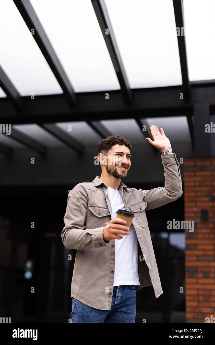 Business man waving goodbye hi-res stock photography and images - Alamy