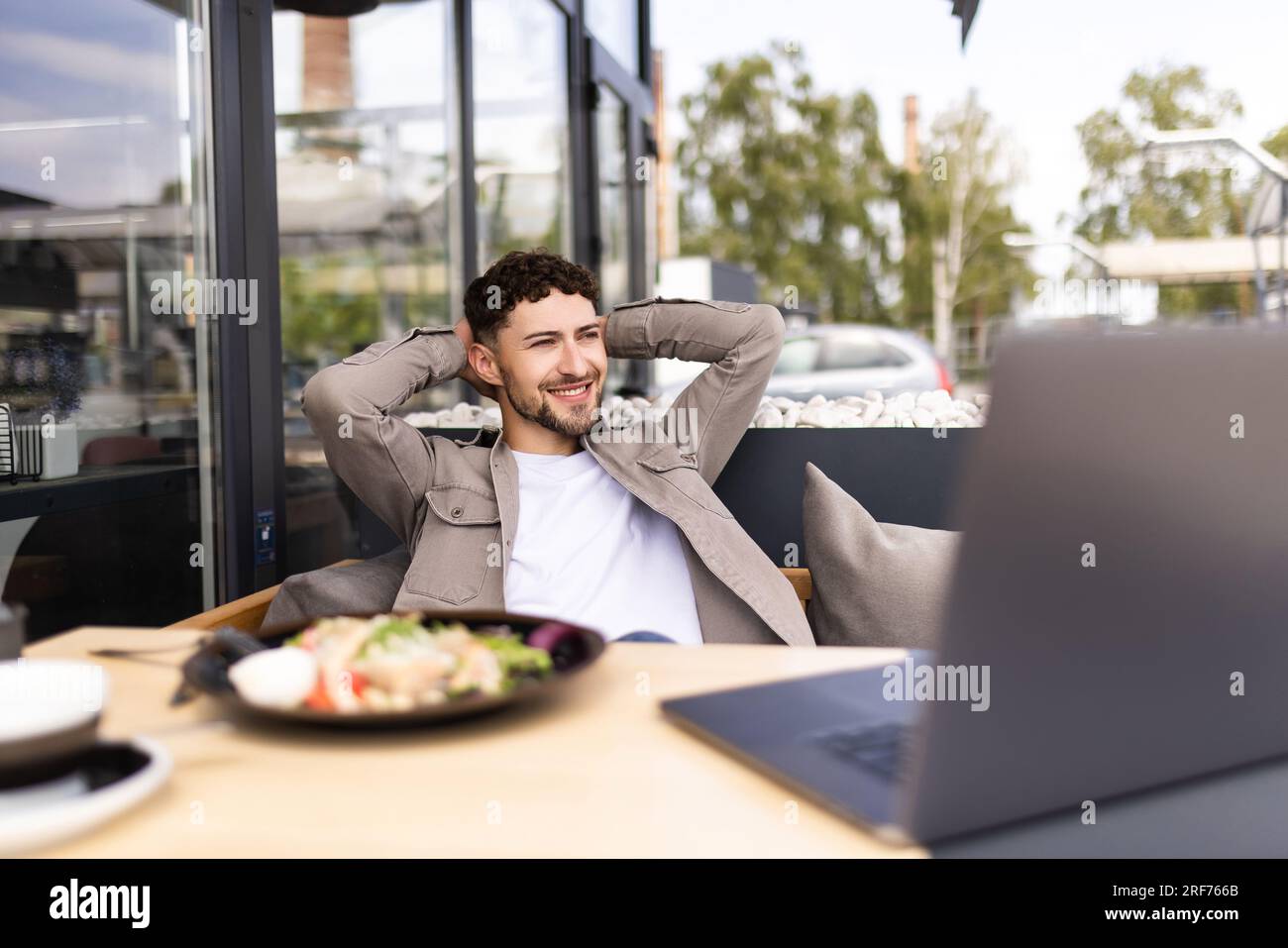 Relaxed businessman at desk cafe table calm man relax break hold hand ...