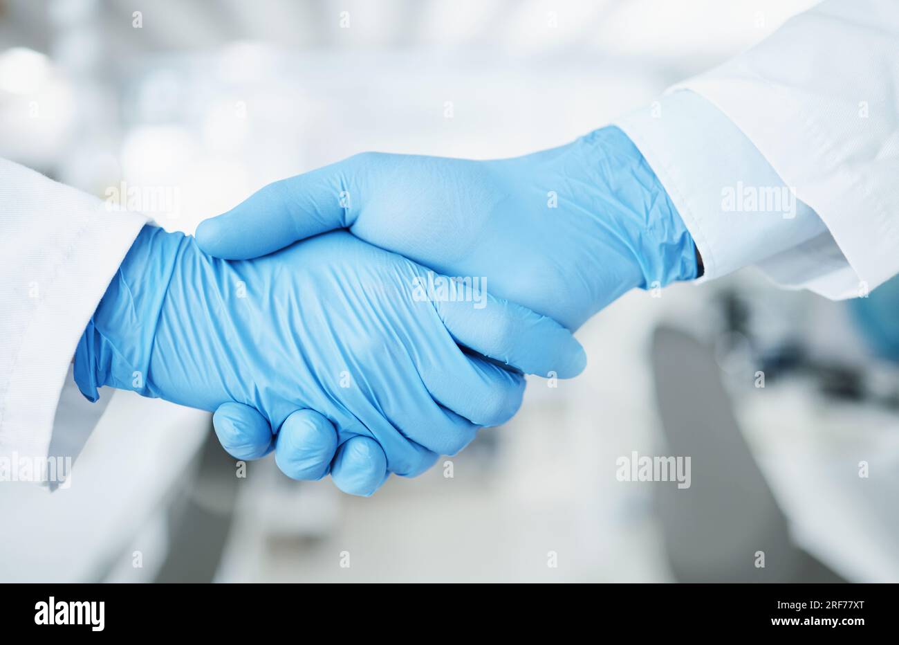 Team handshake, gloves and lab scientist partnership, agreement or ...