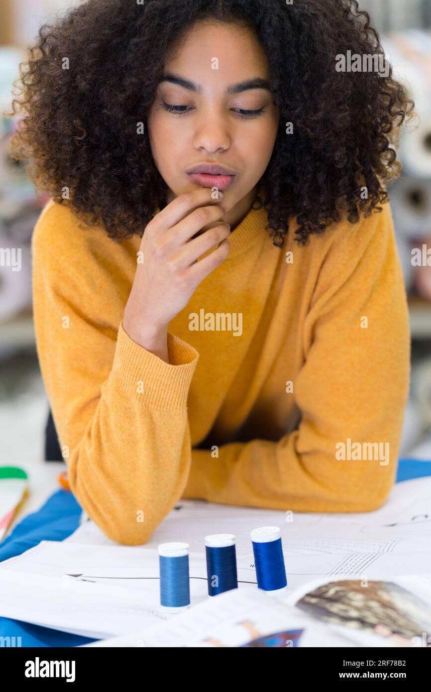 Beautiful woman choosing thread in hi-res stock photography and images ...