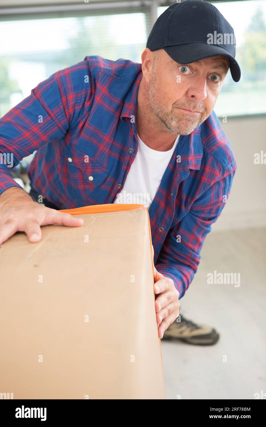 Heavy package hi-res stock photography and images - Alamy