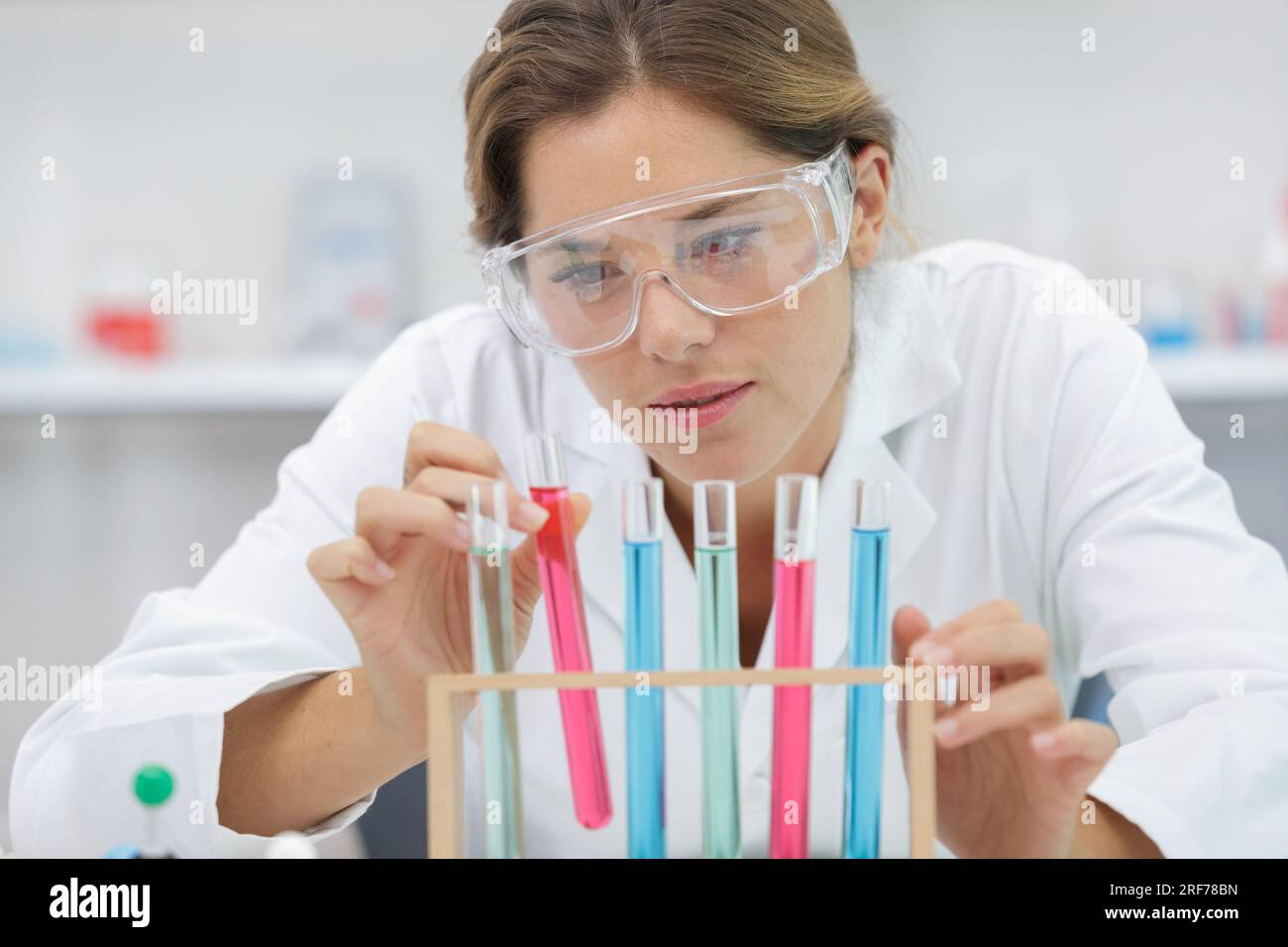 Scientist examining conical flask hi-res stock photography and images ...