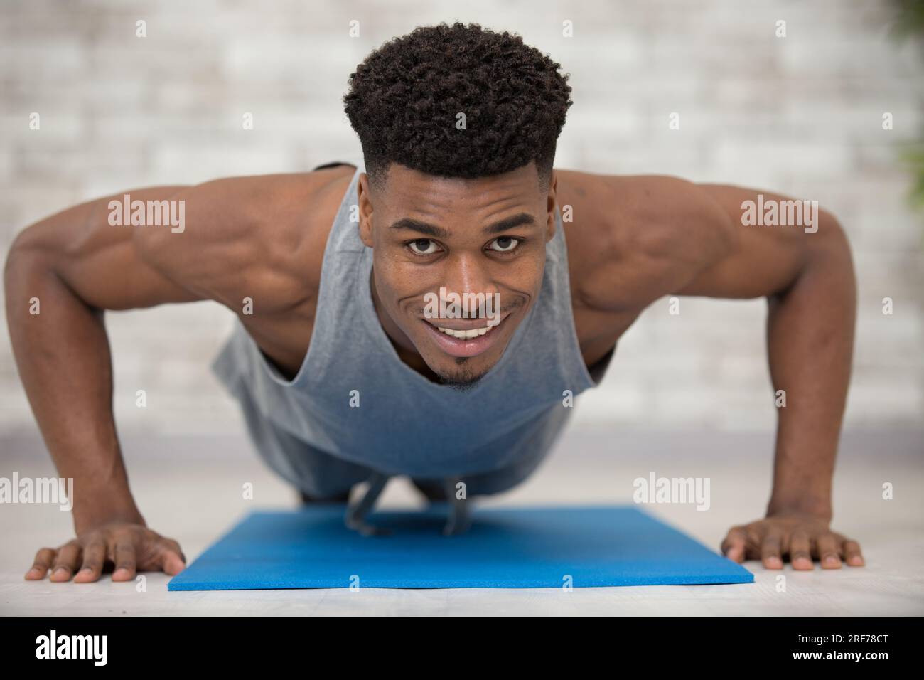 Athletic man stretching body holding hi-res stock photography and ...