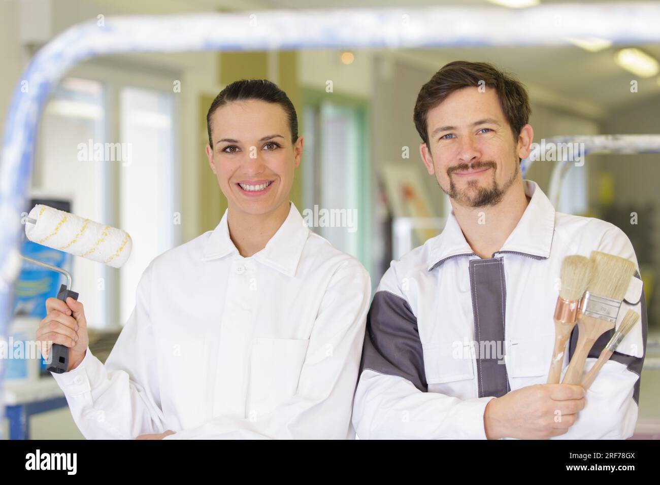 male and female painting and decorating team Stock Photo - Alamy