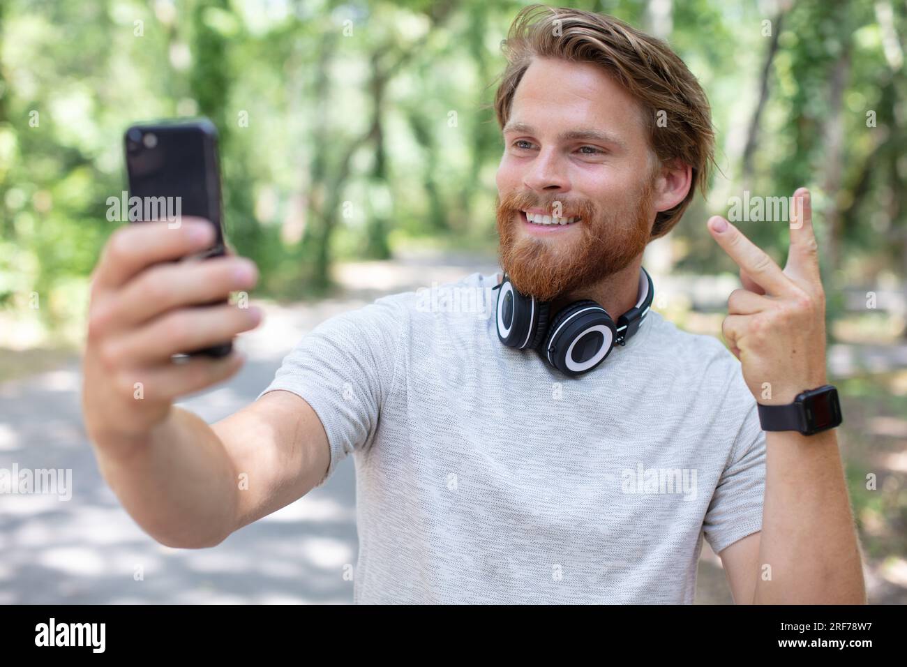 closeup photo portrait of handsome positive cheerful guy Stock Photo ...