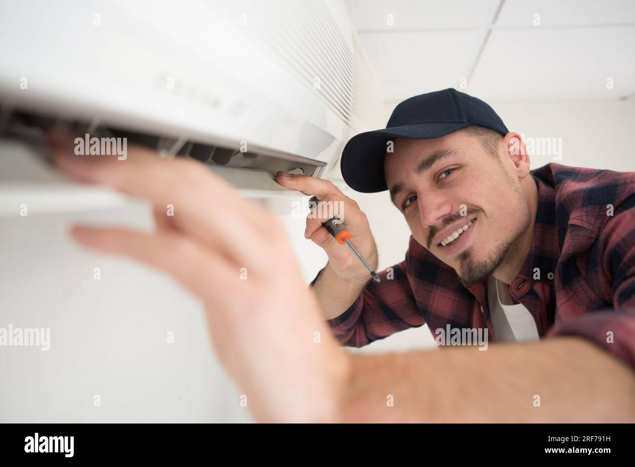 Aircon technician hi-res stock photography and images - Alamy
