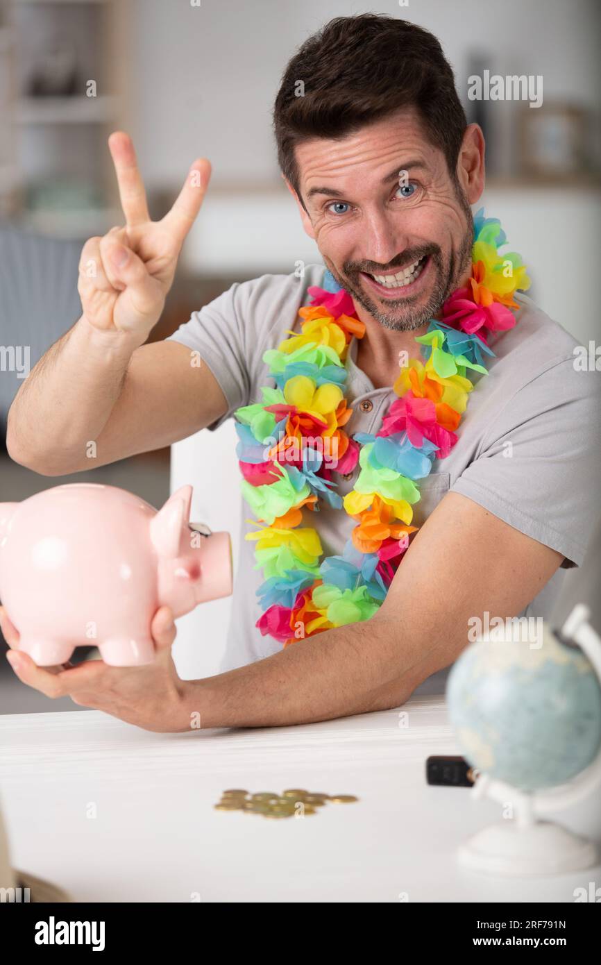 happy man smiling and showing victory sign Stock Photo - Alamy