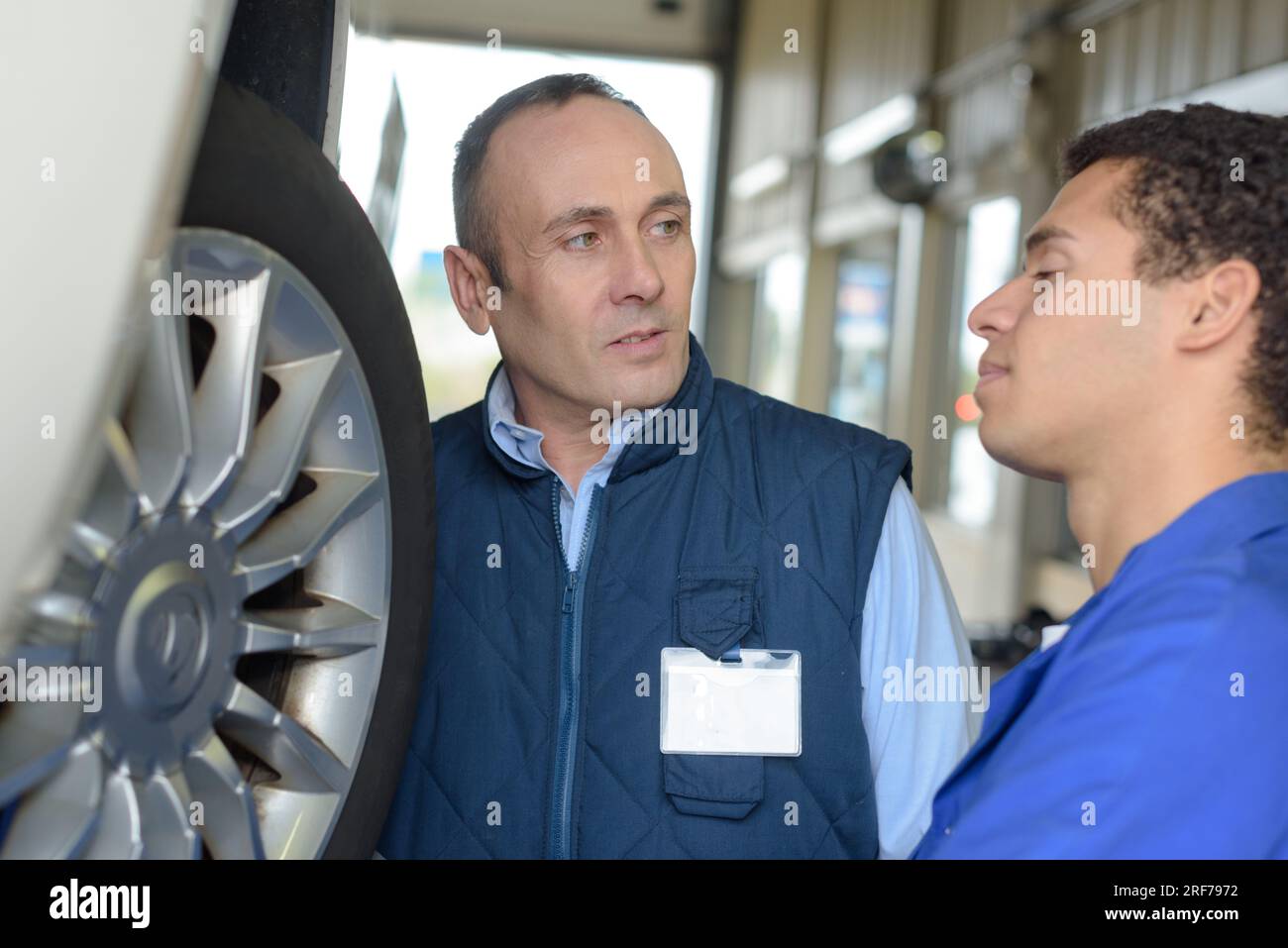 multi-ethnic male auto mechanics in shop Stock Photo - Alamy
