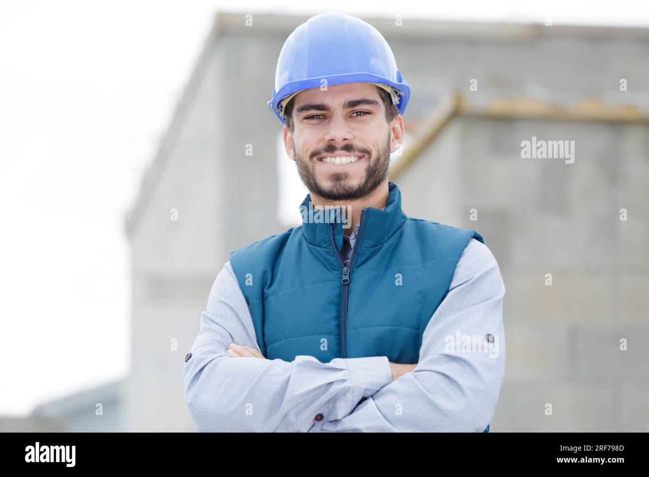 construction worker with crossed arms Stock Photo - Alamy