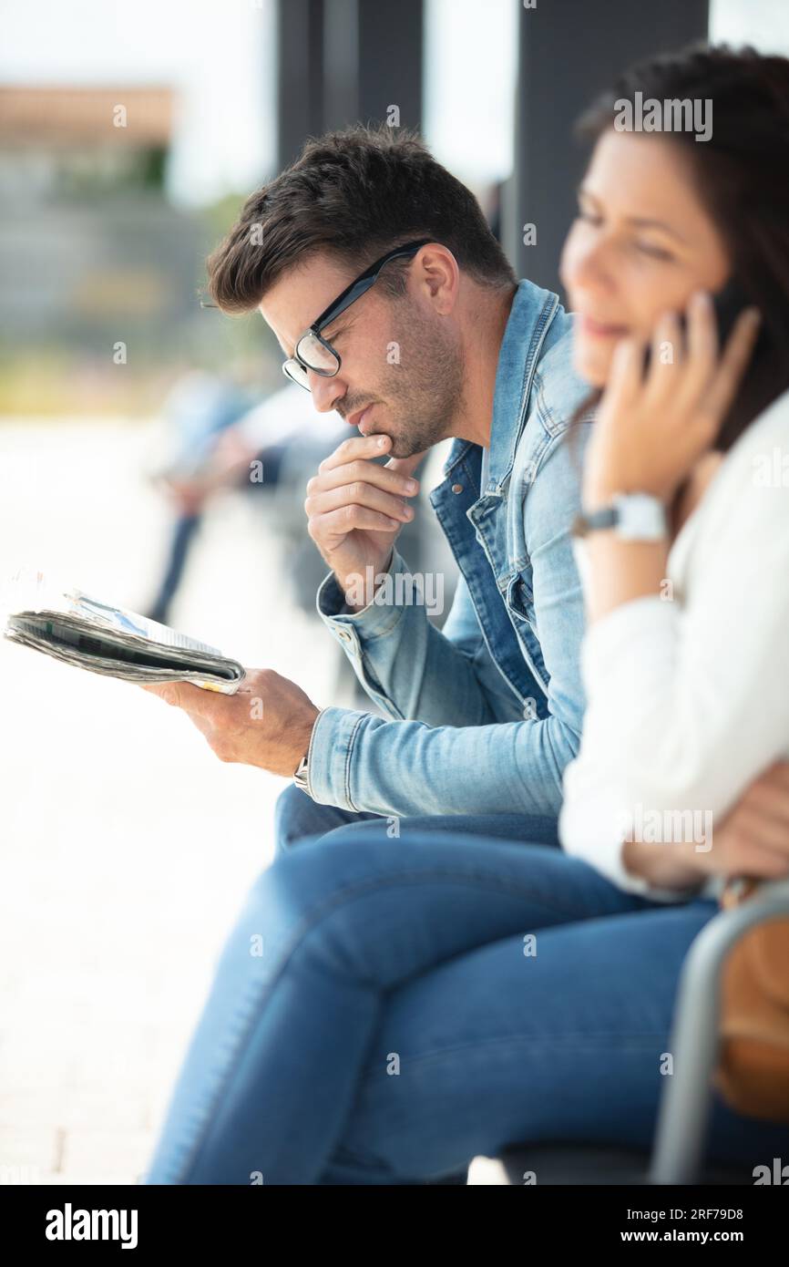 Queue of people at bus stop hi-res stock photography and images - Alamy