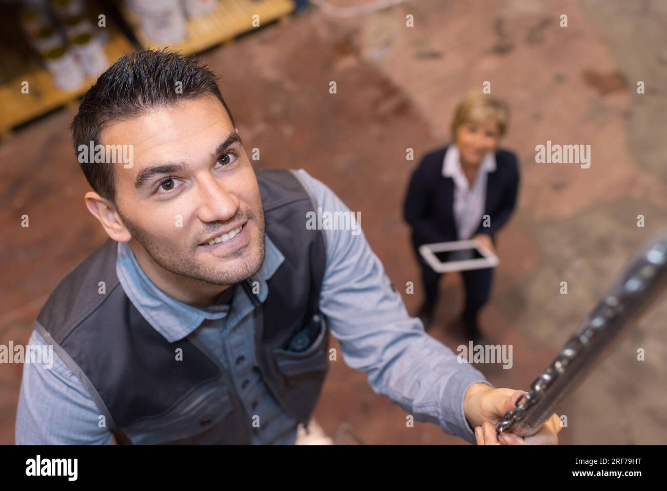 Warehouse worker climbing ladder hi-res stock photography and images ...