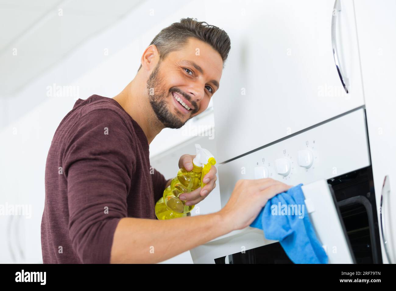 Young man carefully cleaning hi-res stock photography and images - Alamy