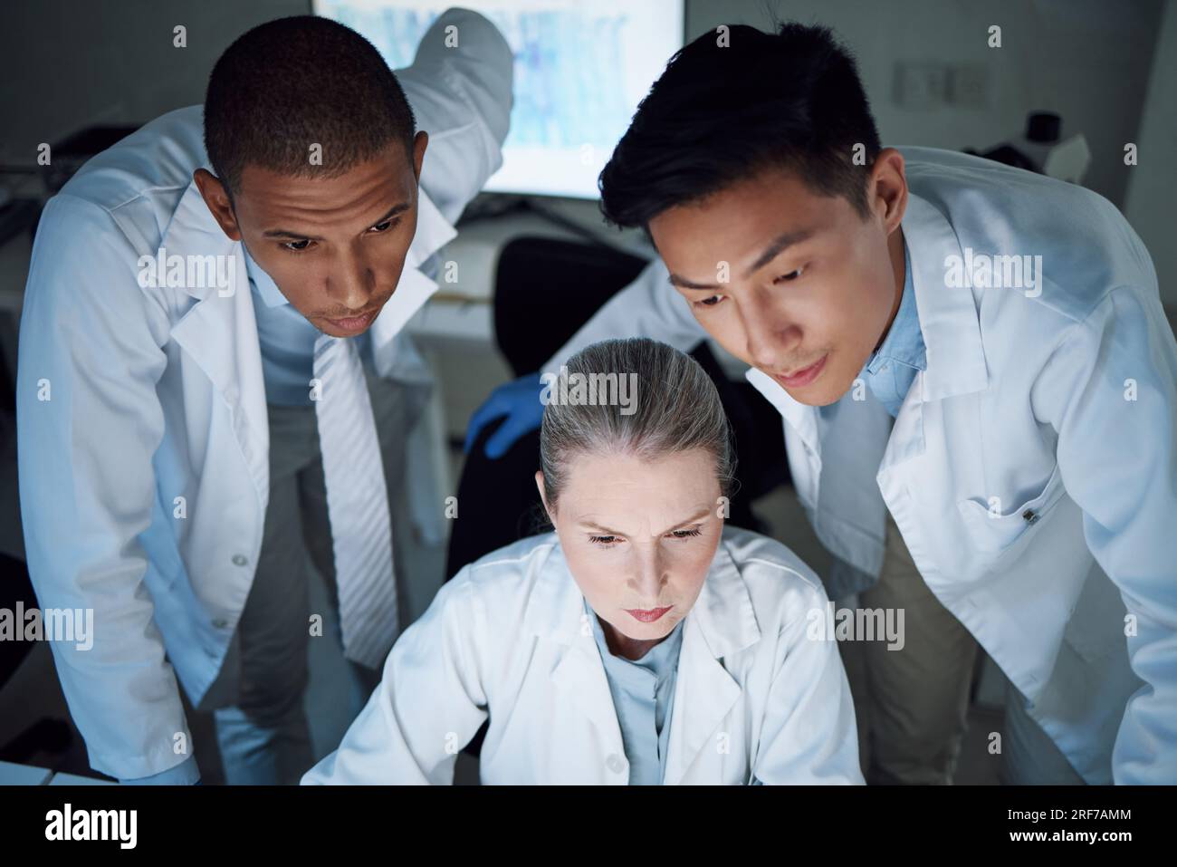 Scientist group, thinking together and analysis in laboratory, night ...