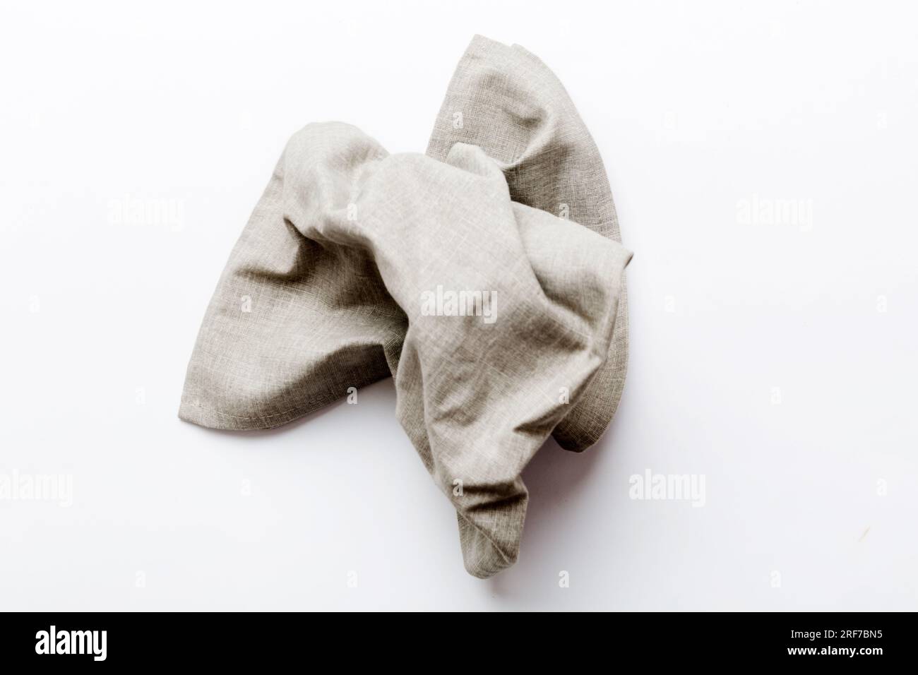 top view with gray kitchen napkin isolated on table background. Folded ...