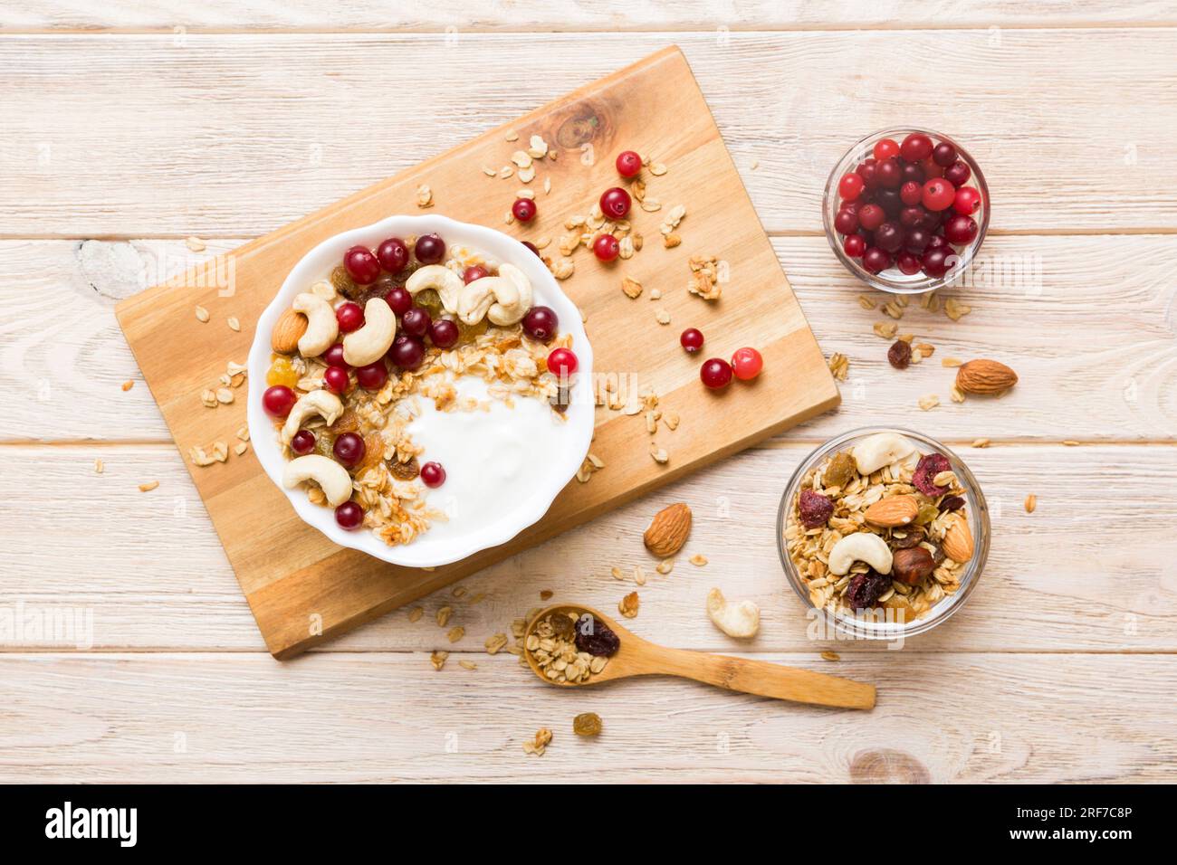 Healthy breakfast food with granola, yogurt, fruits and nuts. Dessert ...