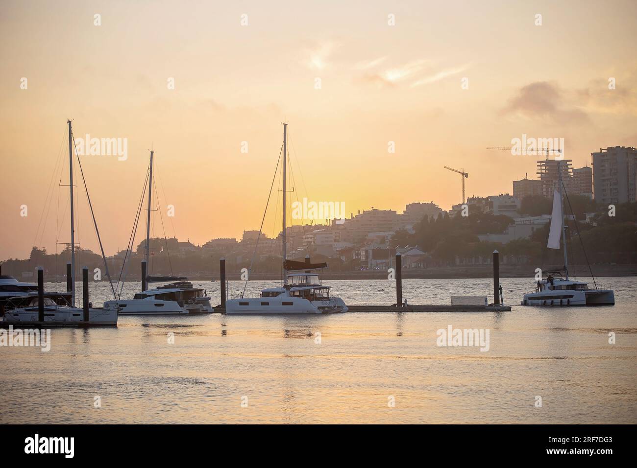 Beautiful sunset over the ocean in Portugal Porto port, boats, sun ...