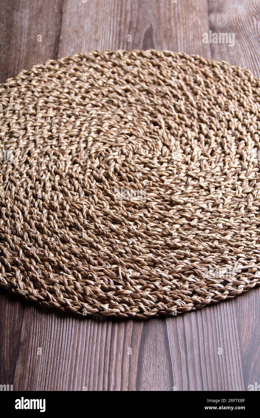 photo of a woven straw napkin on a table, side view, top view Stock ...