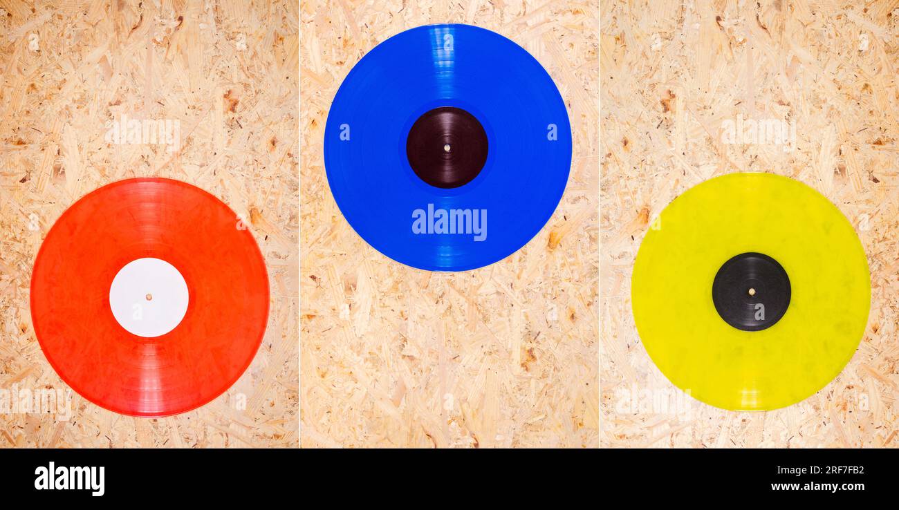 Collection of images with different color vinyl records on plywood ...
