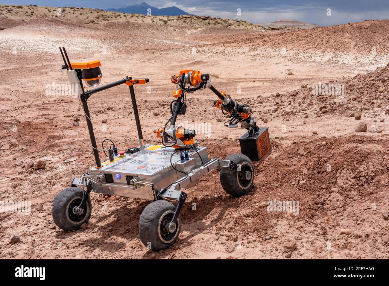 Mars Rover of the Project Scorpio Team picks up a toolbox. University Rover Challenge, Mars ...